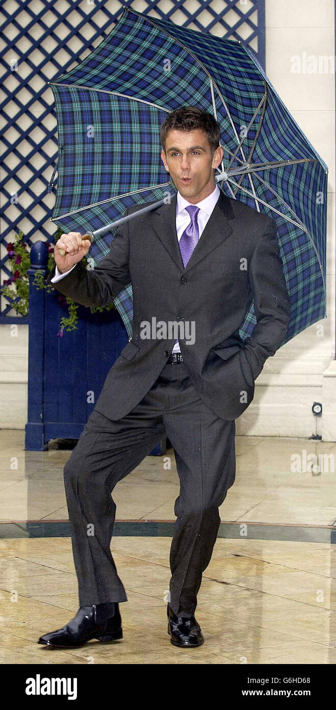 Actor Scott Maslen poses for photgraphers after he was awarded Marks ...
