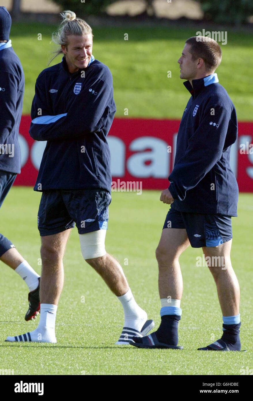 Michael Owen (right) and England captain David Beckham chat during an ...