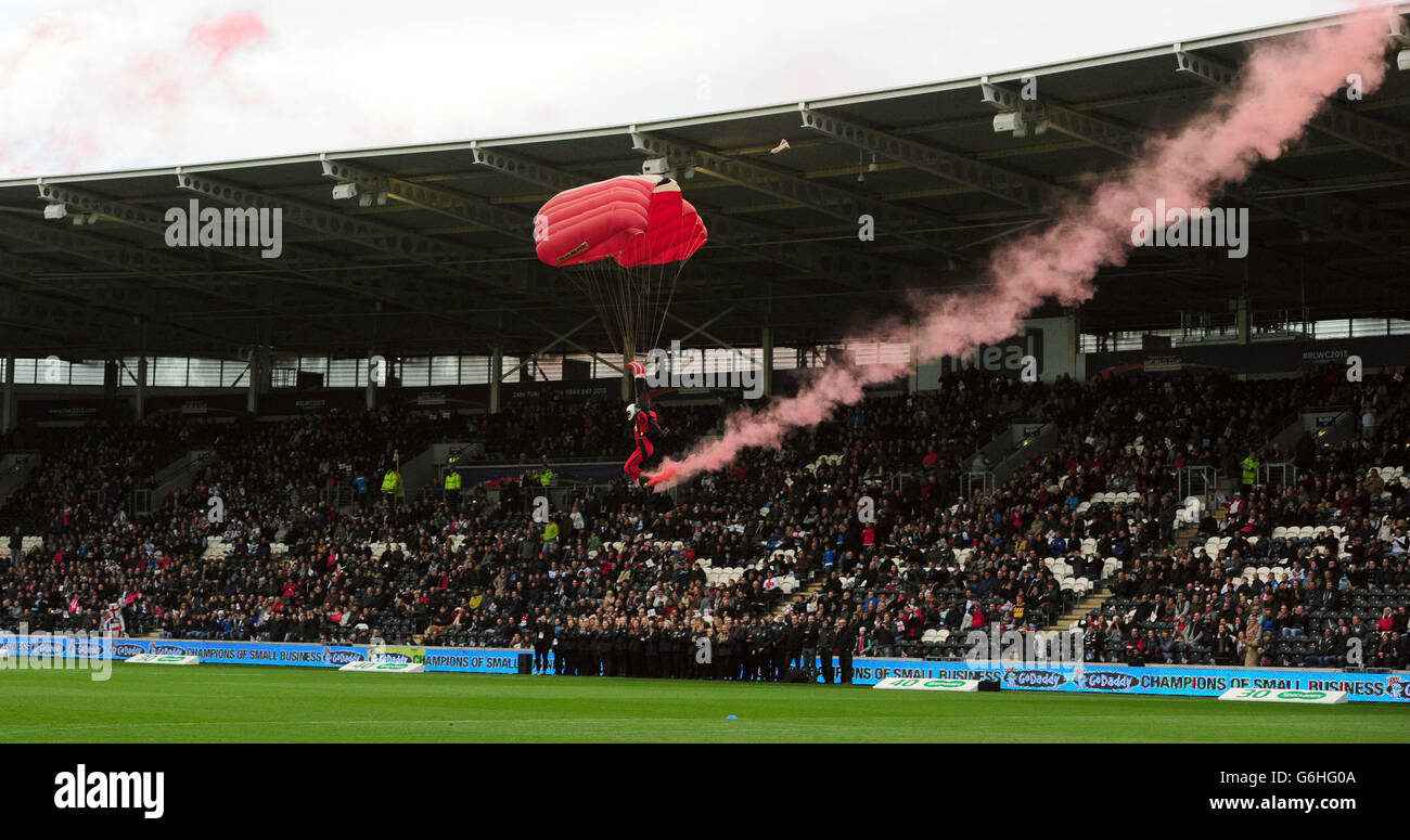 A member of the Red Devils parachute team lands on the pitch before ...