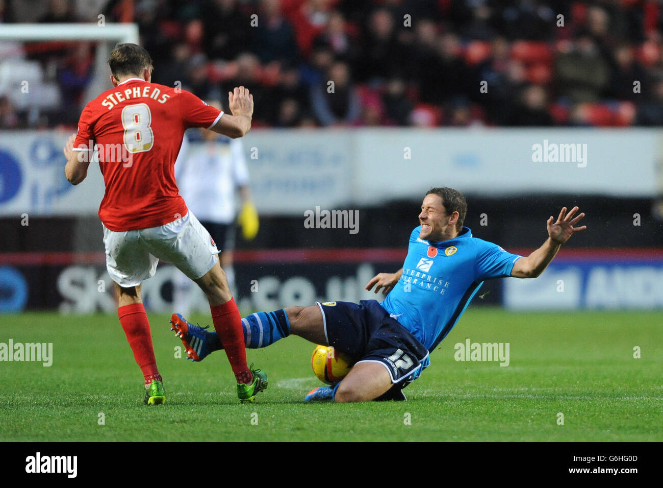 Charlton Athletic's Dale Stephens is tackled by Leeds United's Michael ...