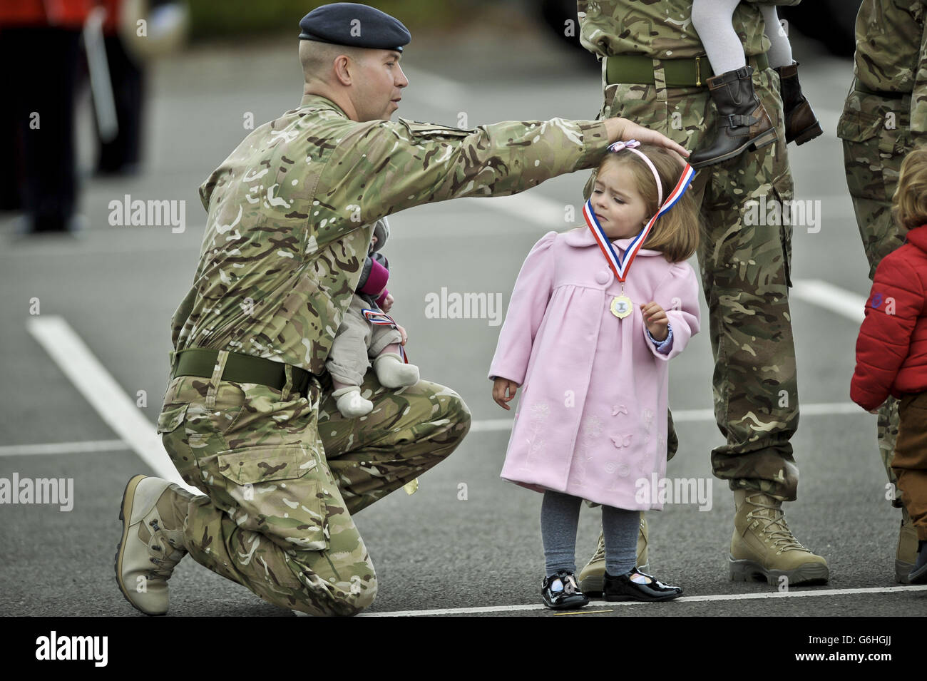 Sergeant Ross Robertson with his children Charlie, aged ten weeks and ...