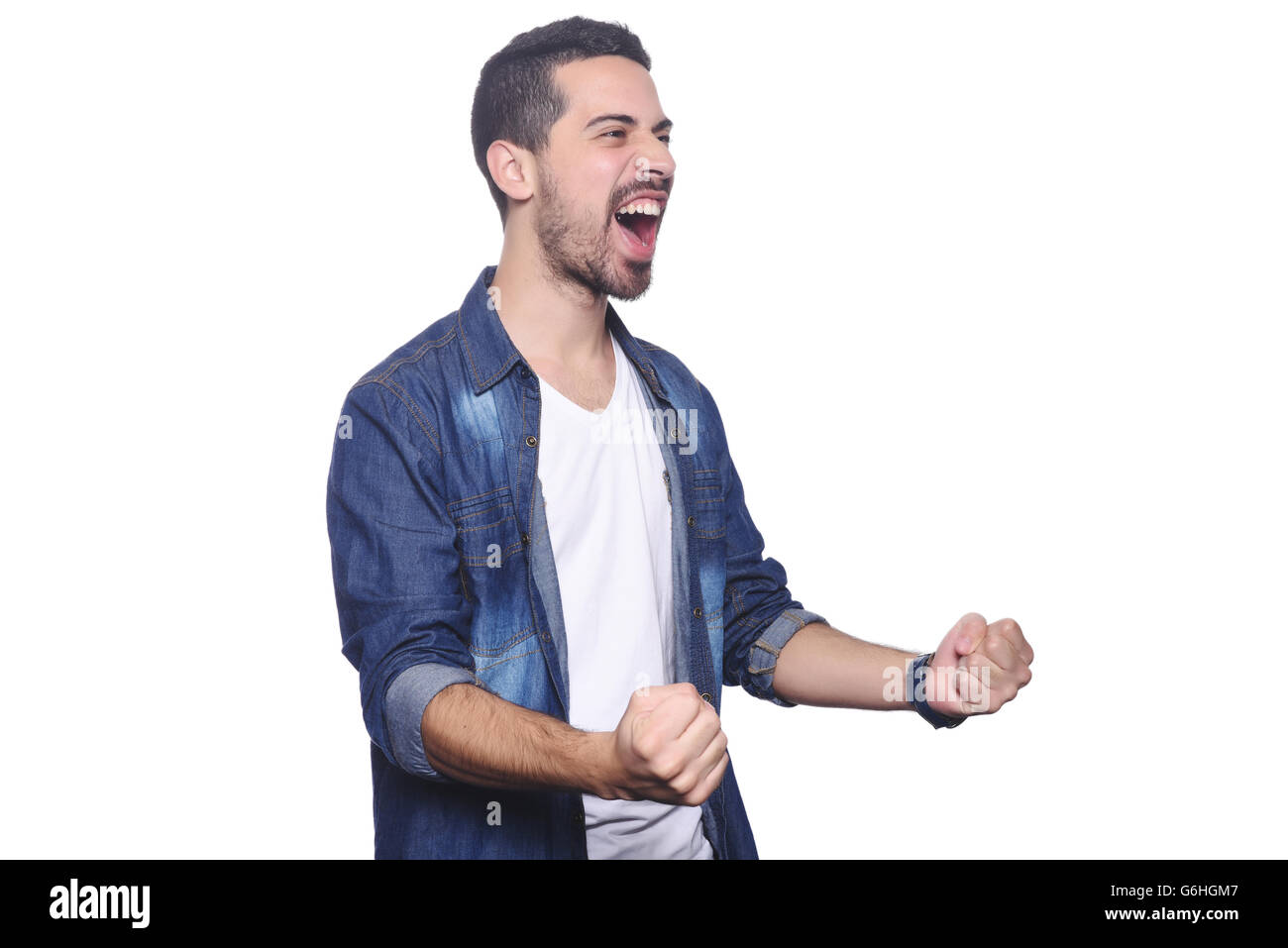 Close up of young latin man celebrating victory. Isolated white ...