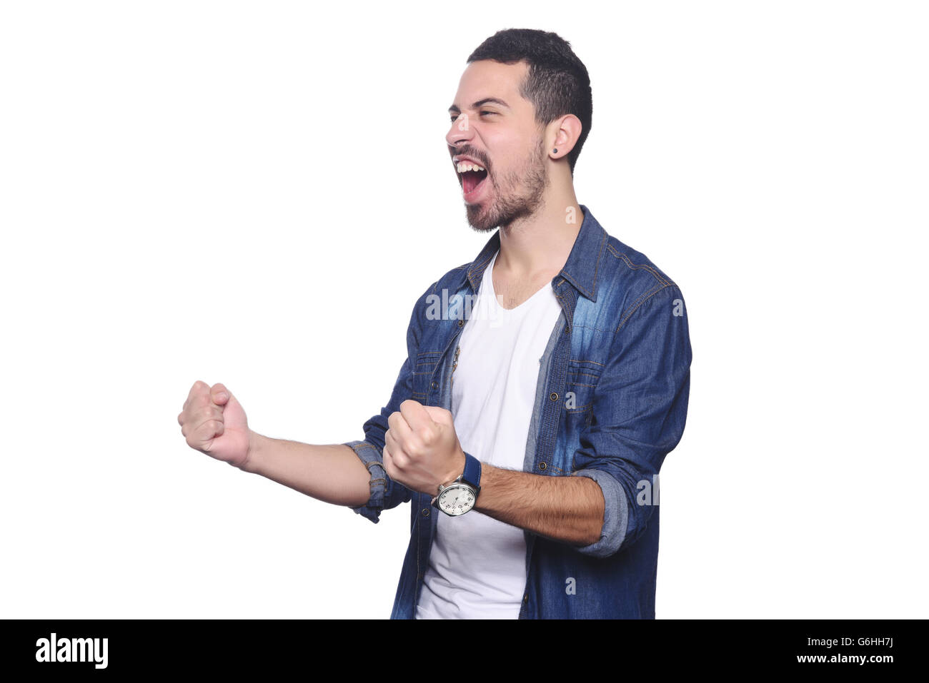 Close up of young latin man celebrating victory. Isolated white ...