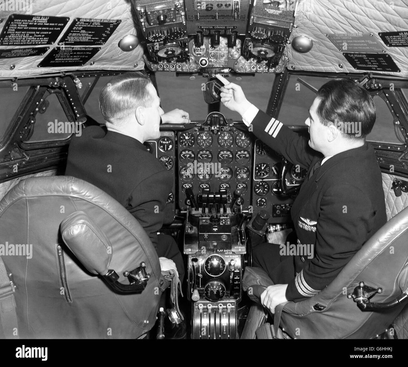 Captain Ernest Rodley (right) explains the controls of a Comet jet ...