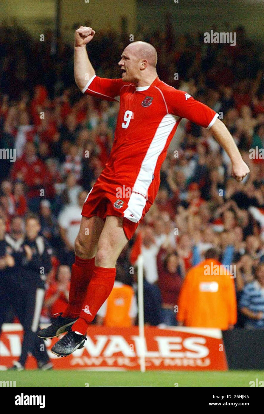 EDITORIAL USE ONLY. Wales' John Hartson celebrates after scoring from ...
