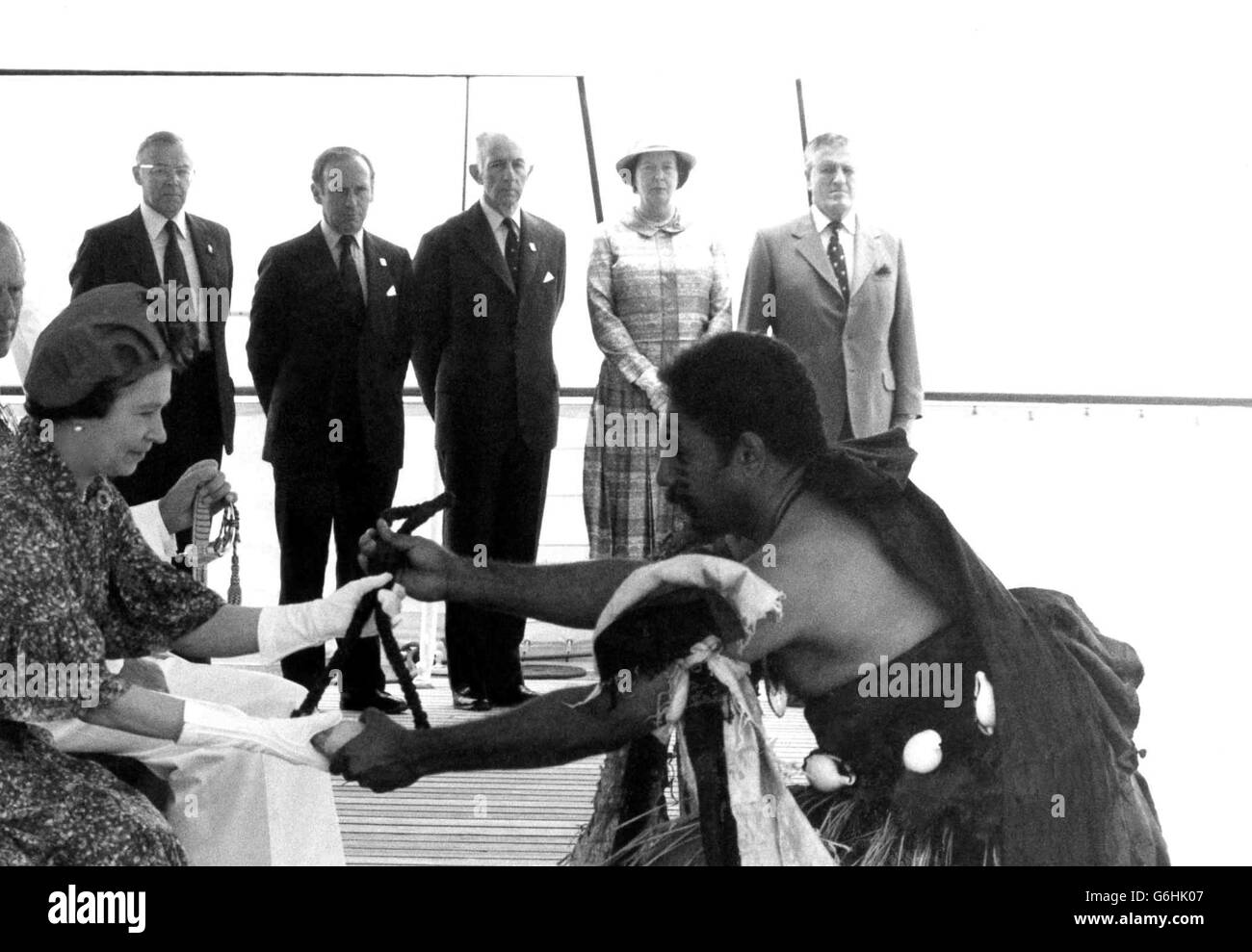 The Queen being given a whale's tooth aboard the Royal Yacht Britannia ...
