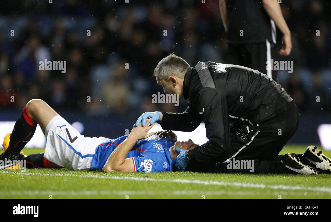 Rangers' Andrew Little receives medical attention after colliding with ...