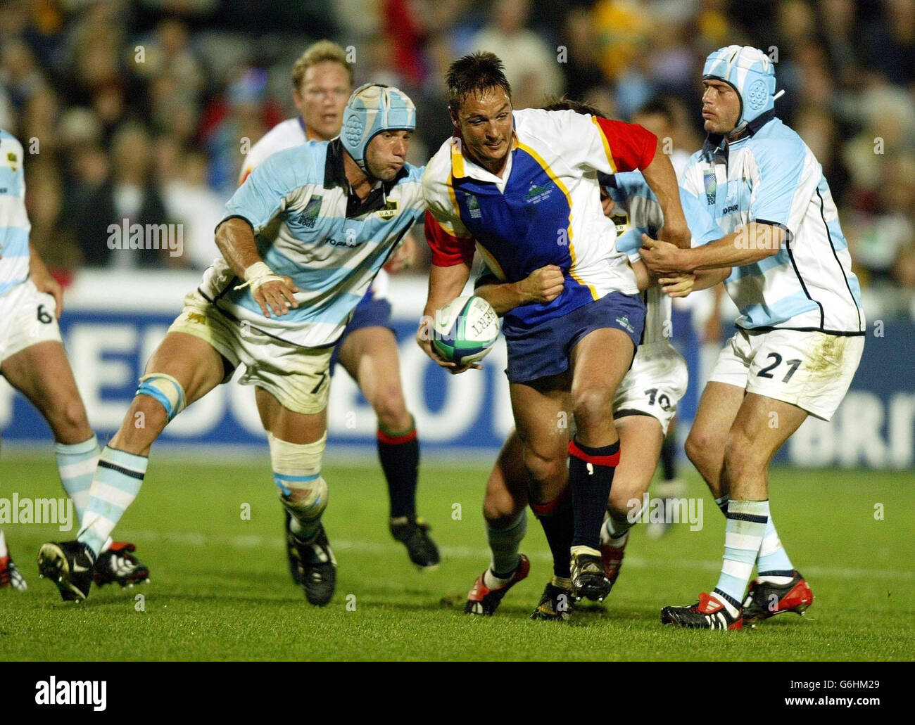 Namibia's Corne Powell (centre) tries to break through the tackles of ...