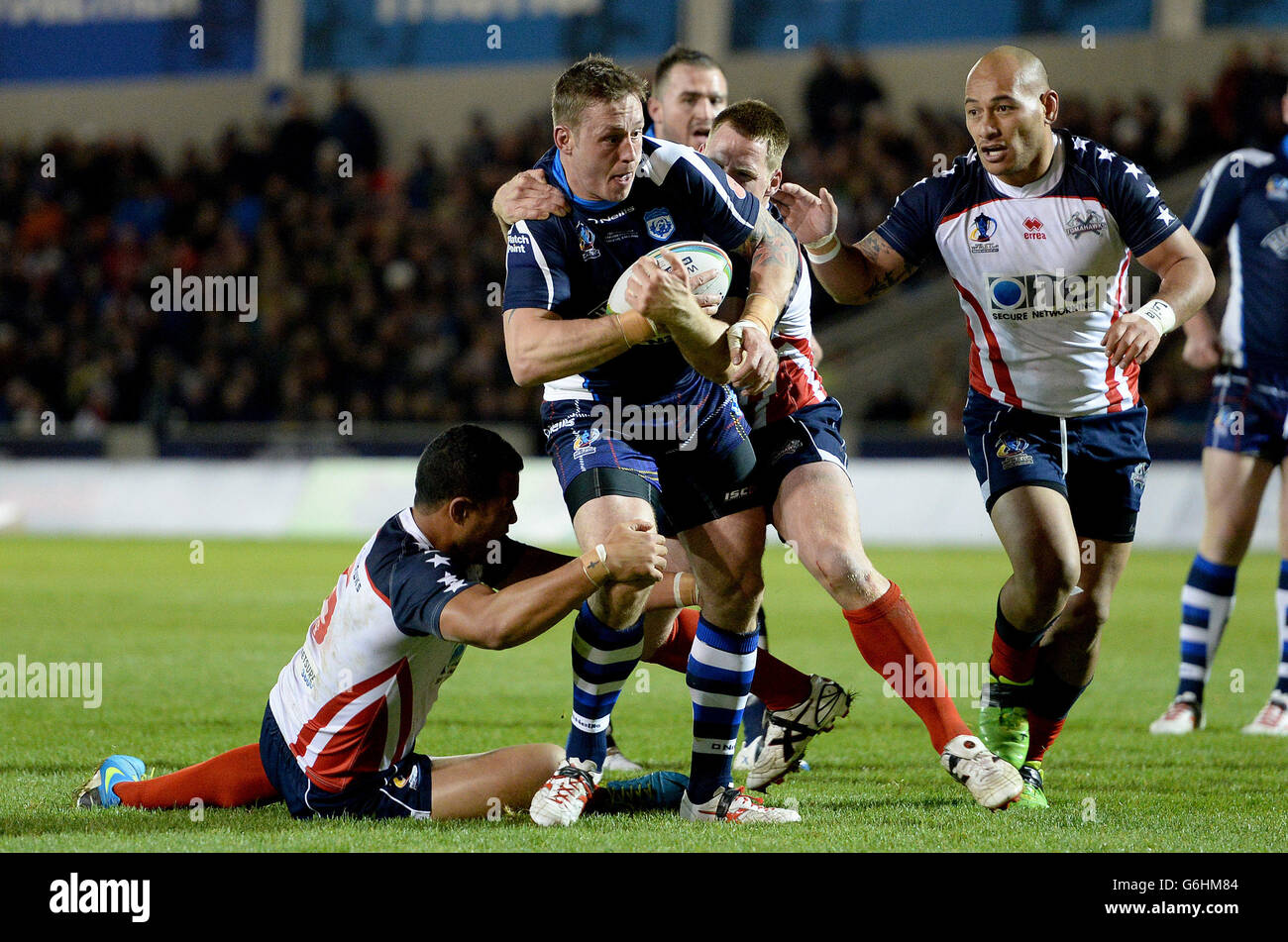 Scotland's Oliver Wilkes is tackled by USA's Joseph Paulo (left) and ...