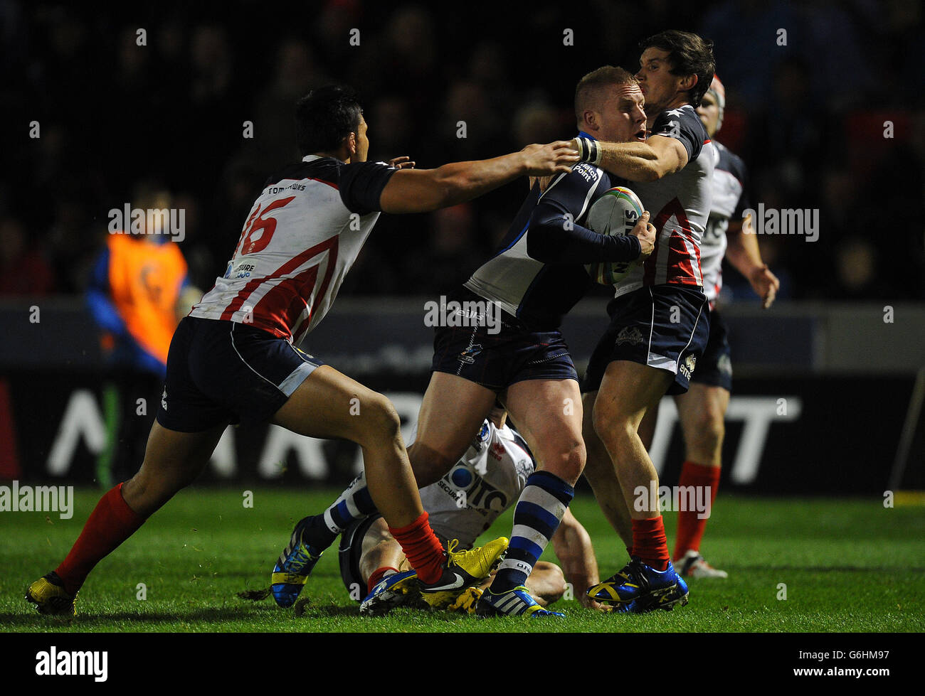 Scotland's Alex Hurst is tackled by USA's Kristian Freed and Haveatama ...