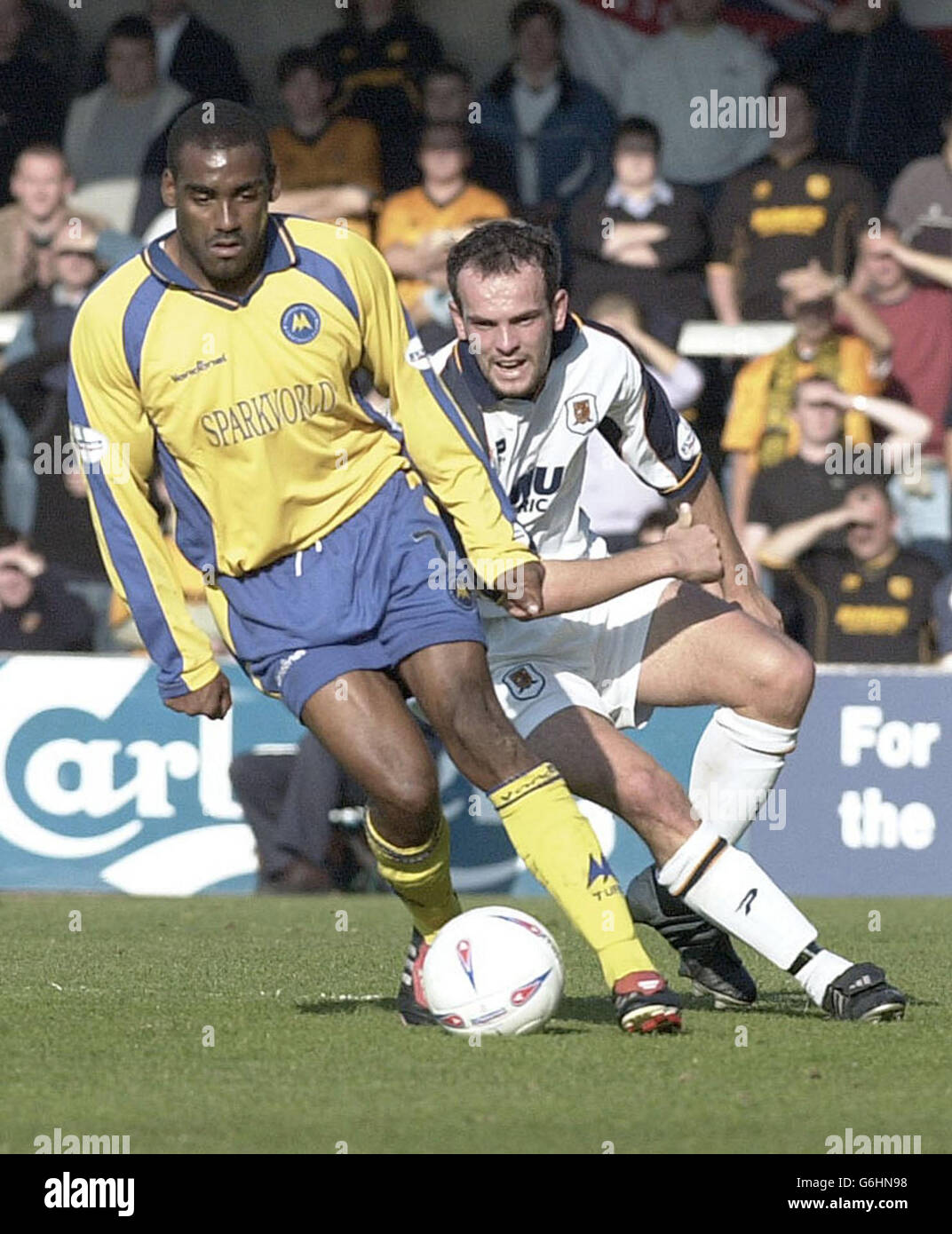 Torquay striker Tony Bedeau (L) shields the ball from Hull City ...