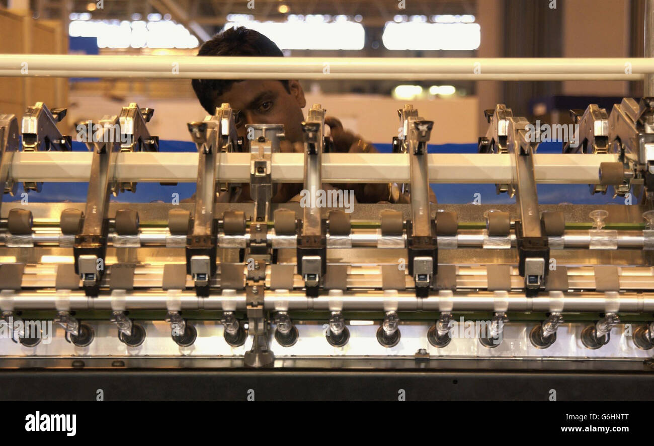 A man puts the finishing on the Lakshmi Machine Works stand - who make ...