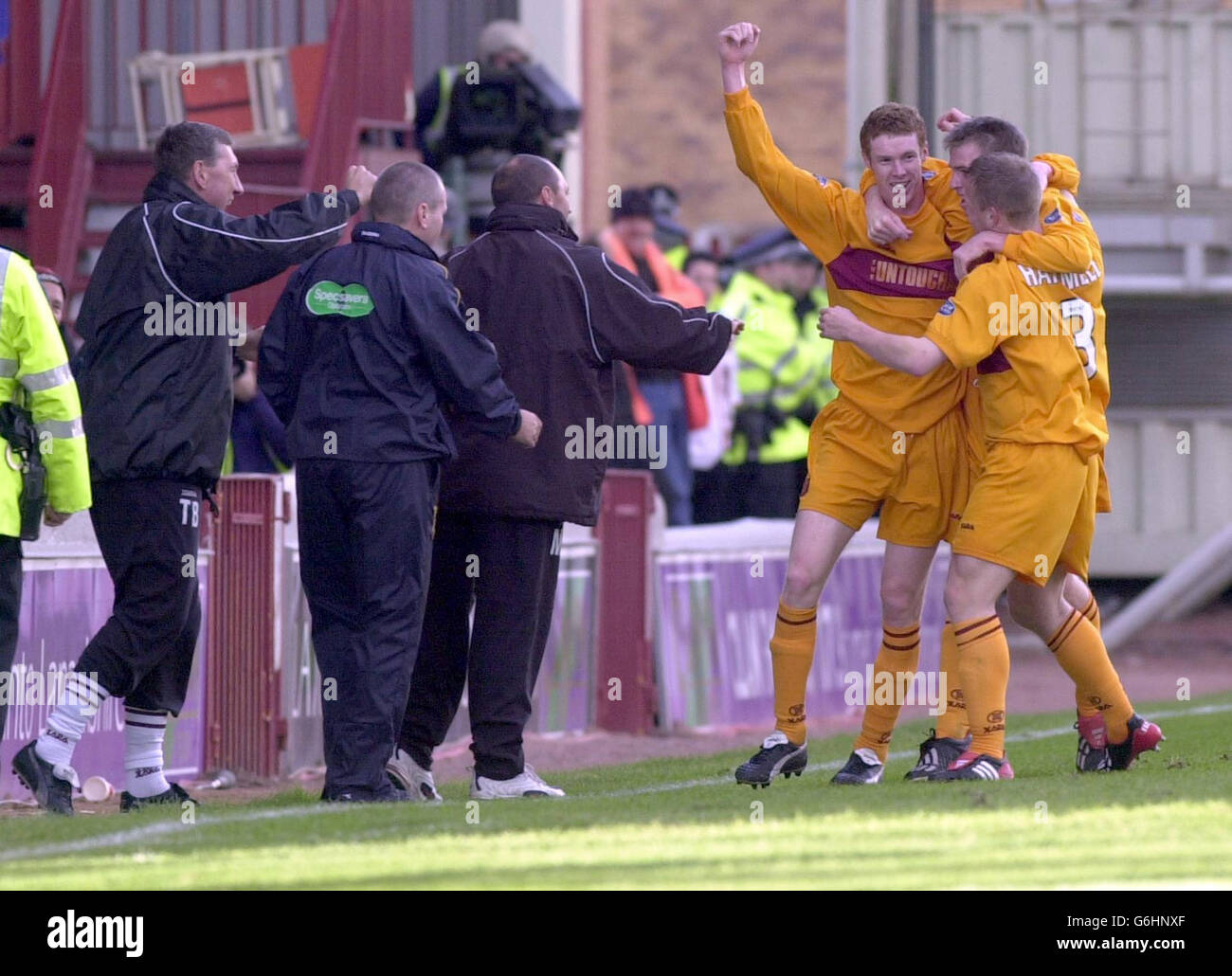 Motherwell player Stephen Pearson (left) celebrates scoring against ...