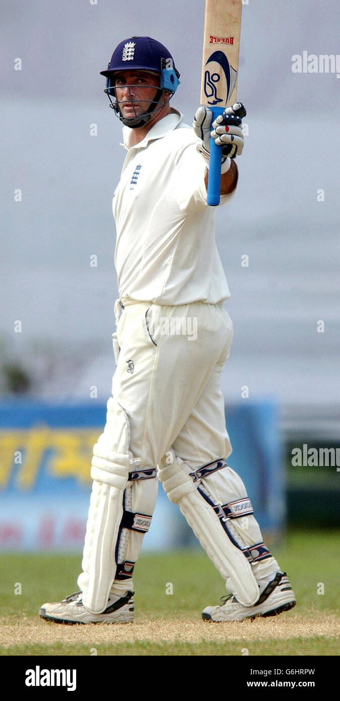 Cricket batsman raising bat hi-res stock photography and images - Alamy