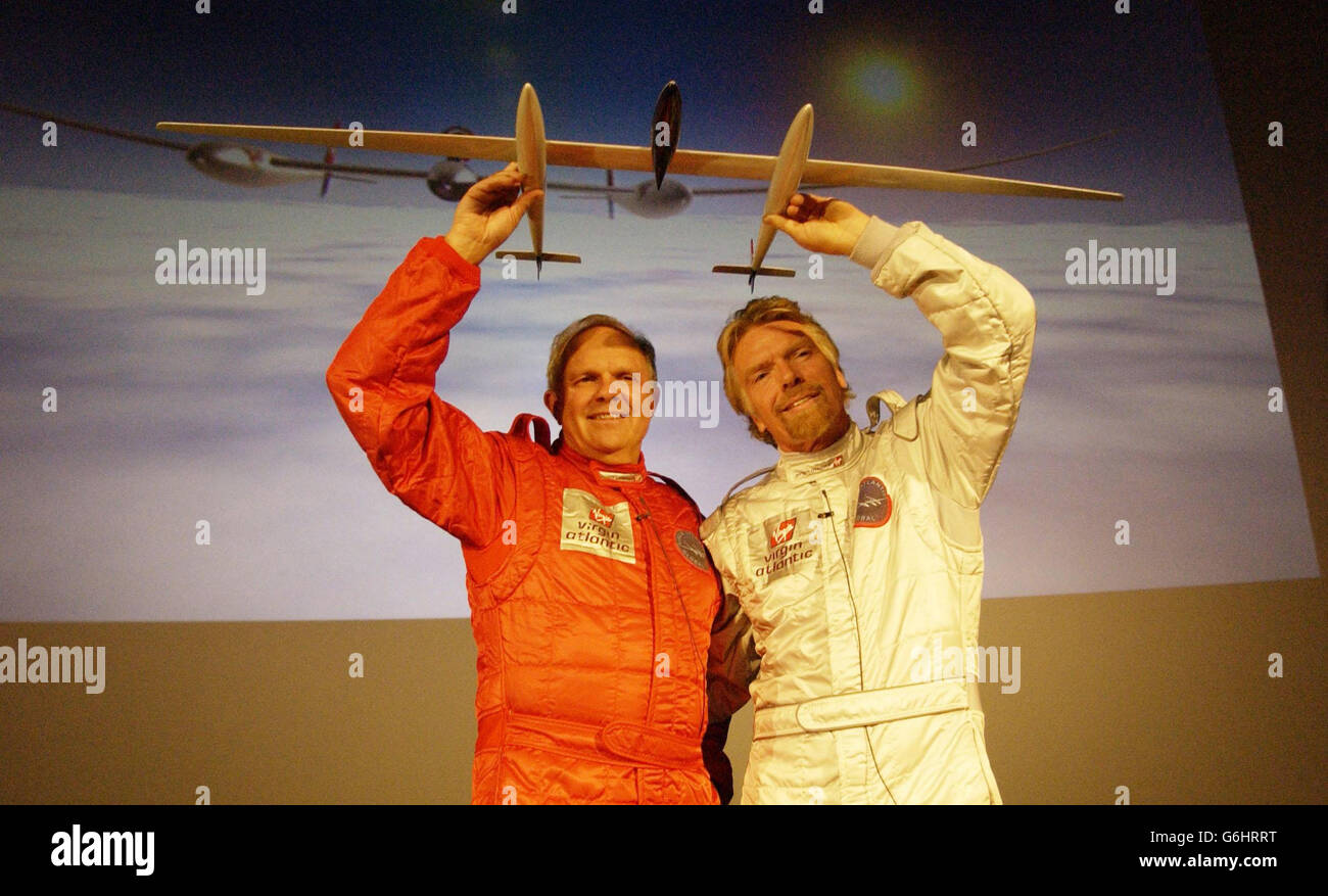 Steve Fossett (left) and Sir Richard Branson hold a model at the ...