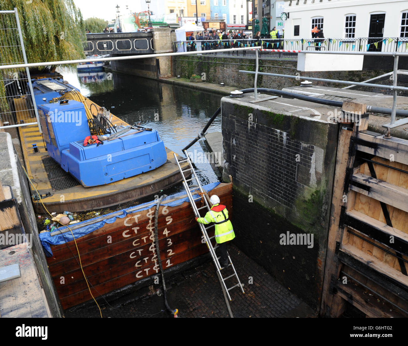 A maintenance worker during an open event as Camden Lock is drained for ...