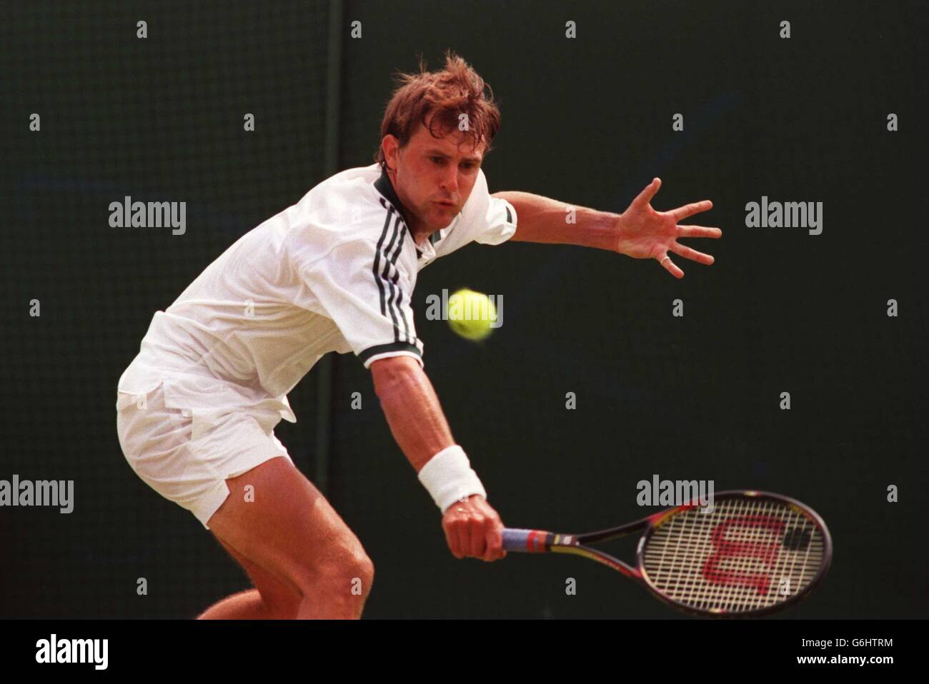 26-JUN-96, Wimbledon, England's Colin Beecher returns returns aback ...