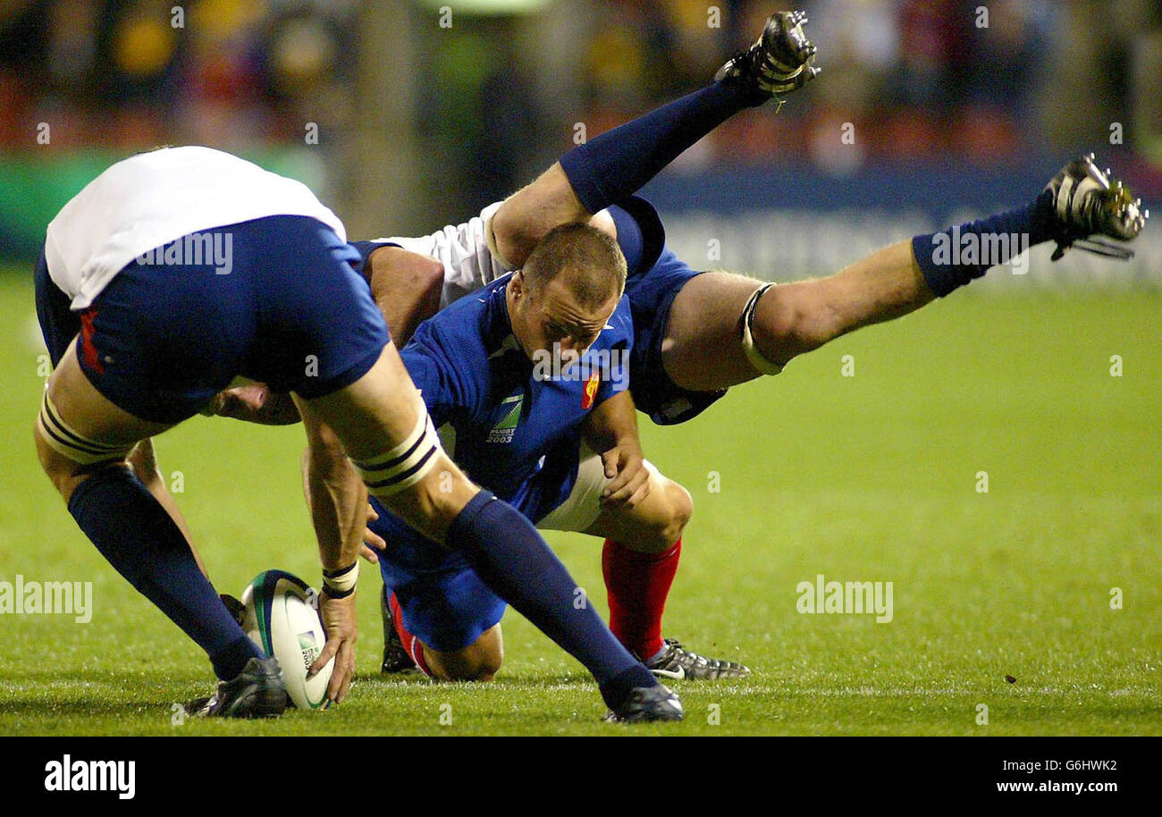 France's Yannick Bru loses the ball under pressure from USA's Luke ...