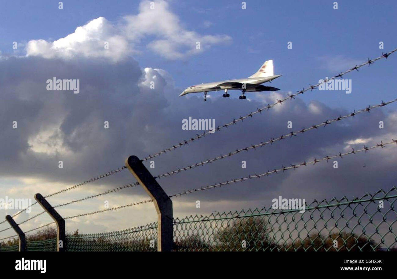 Spectators watch as the first of three Concorde jets approach Heathrow ...