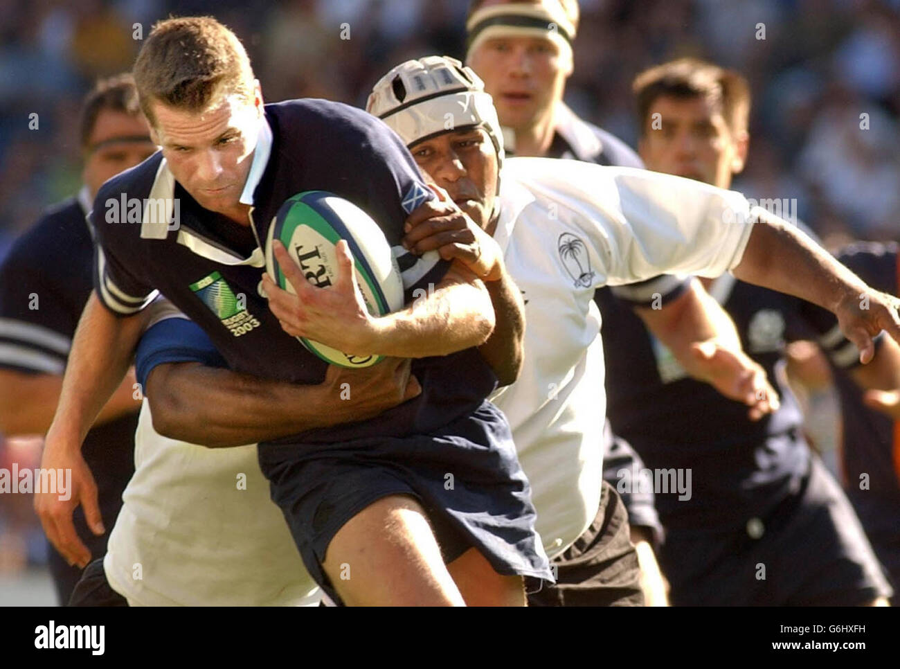 Scotland`s Chris Paterson holds off Fiji`s Nacanieli Seru during their ...