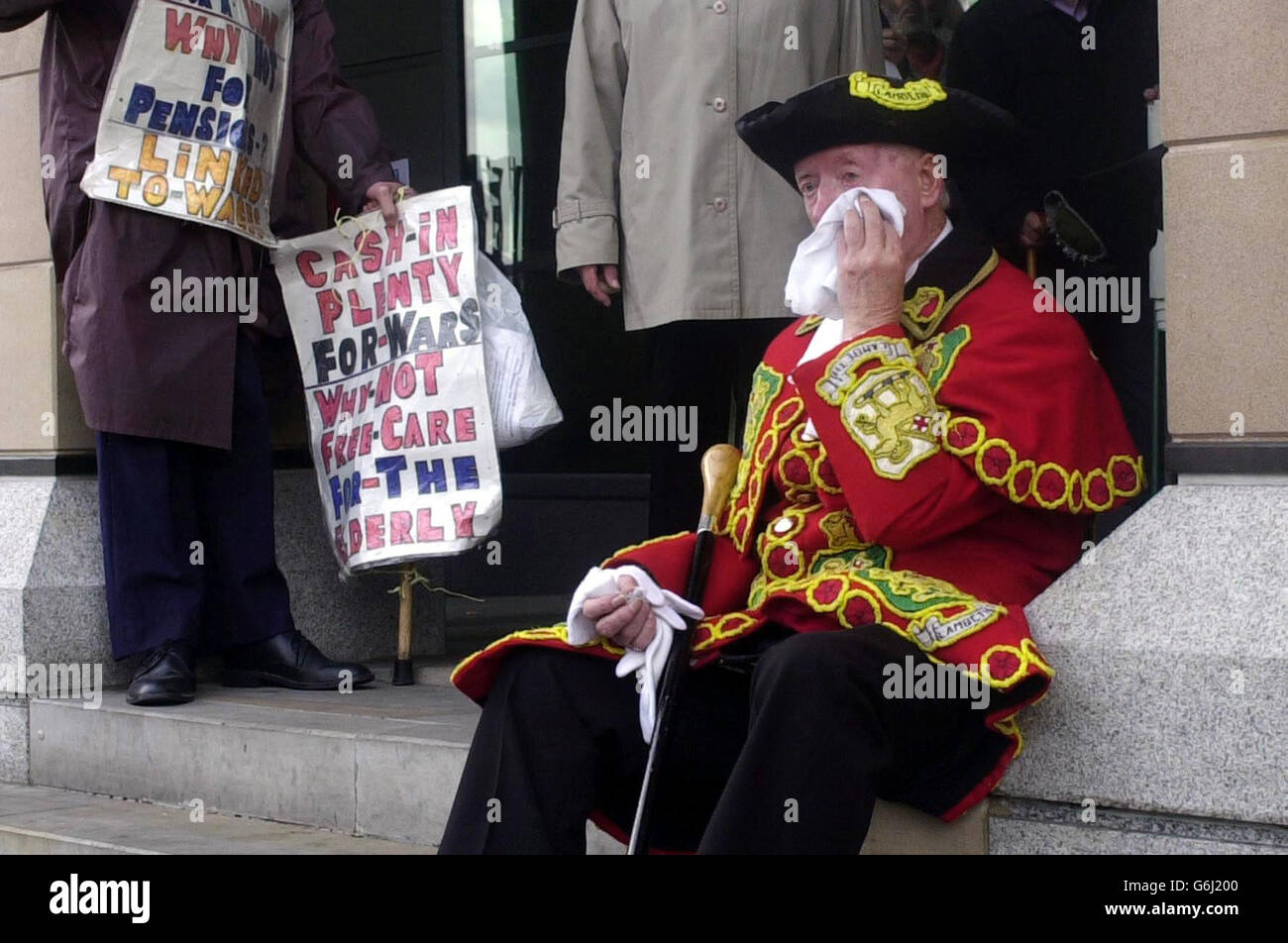 The Town Crier of Lambeth, Alfie Howard is sat on the steps of ...