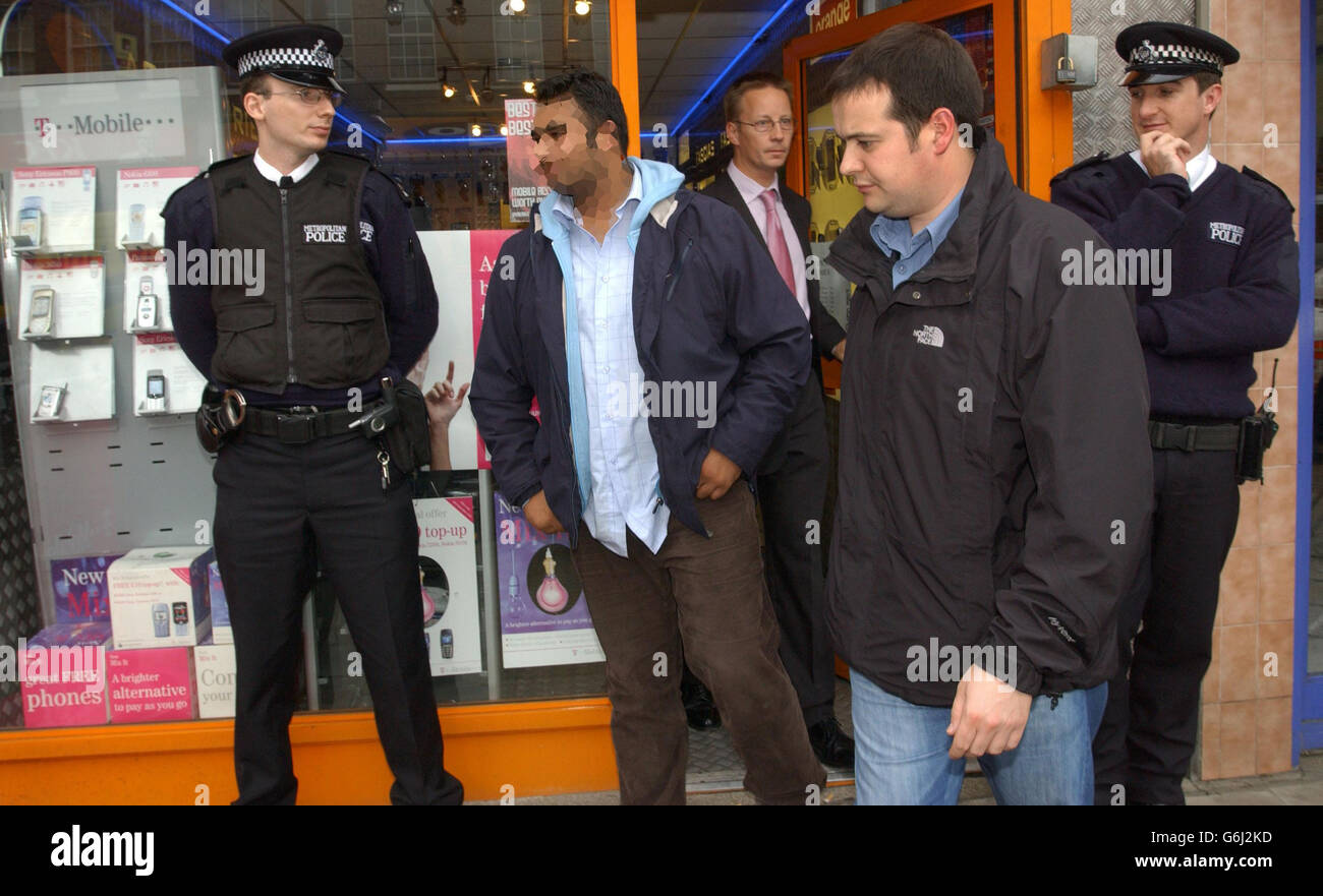 Shop manager under arrest Stock Photo - Alamy