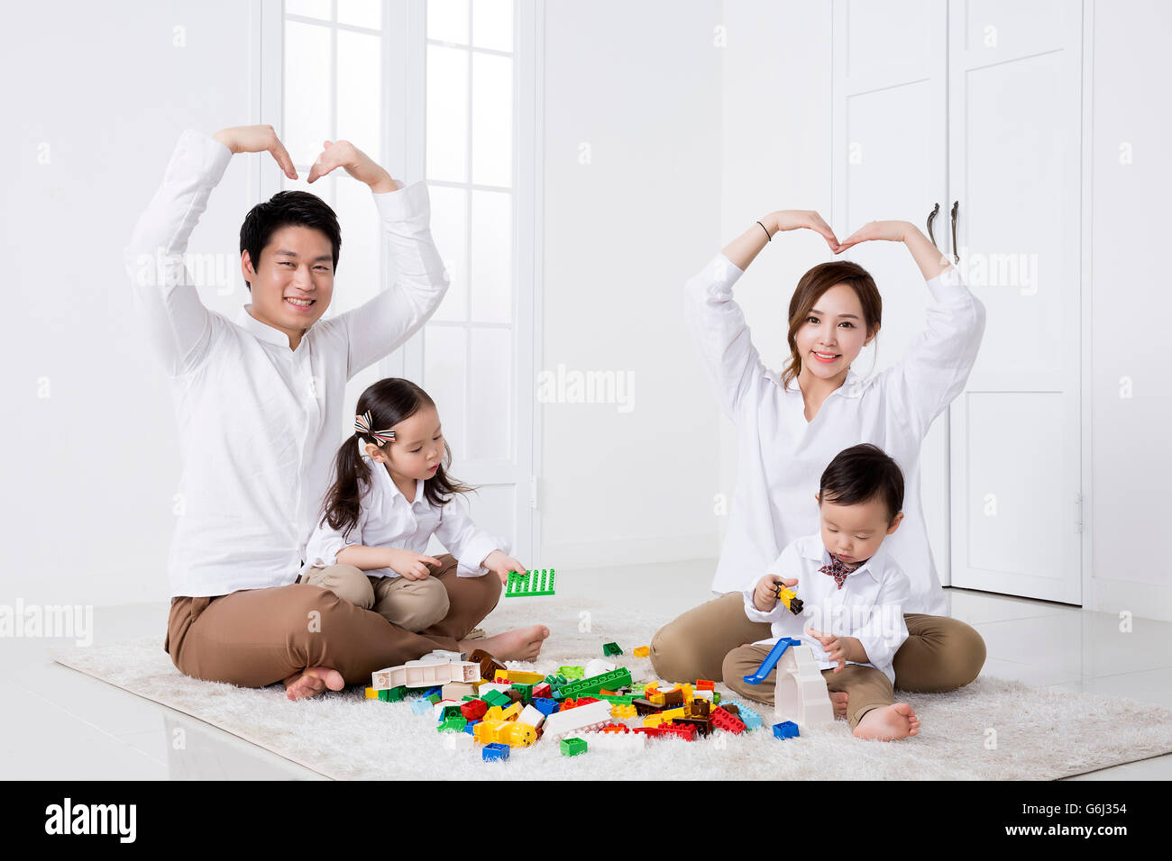 Happy Asian Family Playing with Building Blocks at Home Stock Photo - Alamy