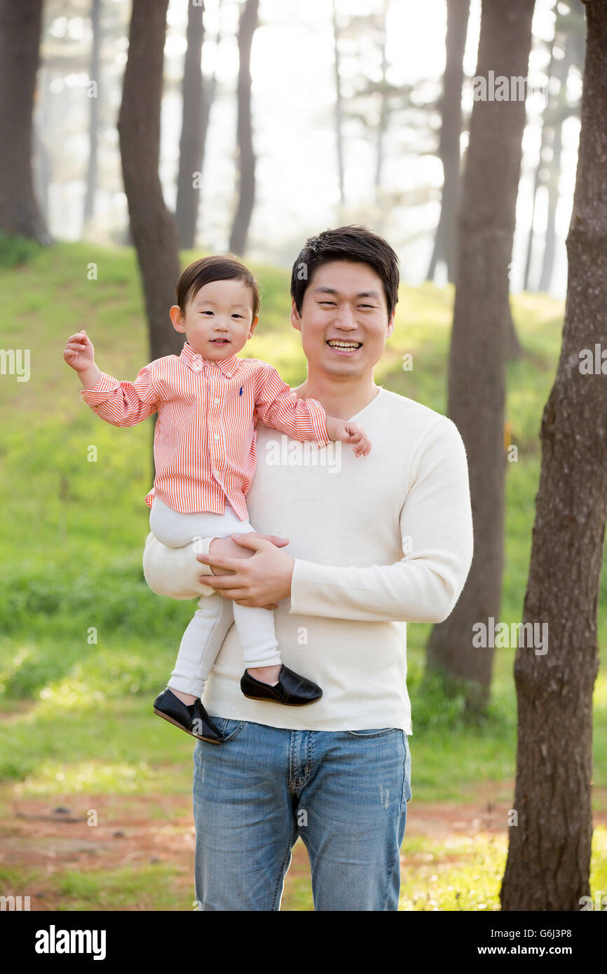 Happy Asian Father and Son Smiling, Posing in Forest, Father Carrying ...