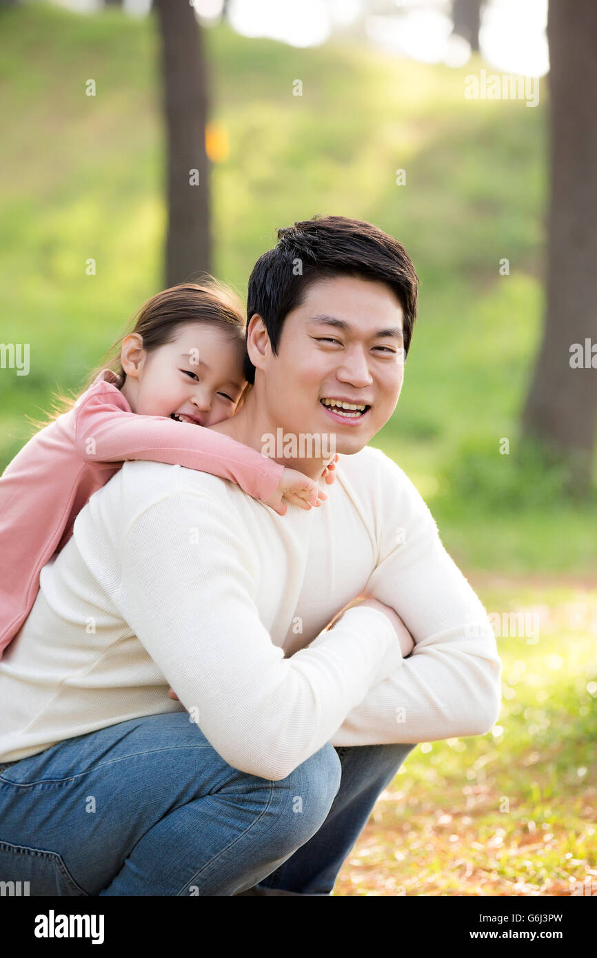 Happy Asian Father and Daughter Smiling and Posing in Forest Stock ...