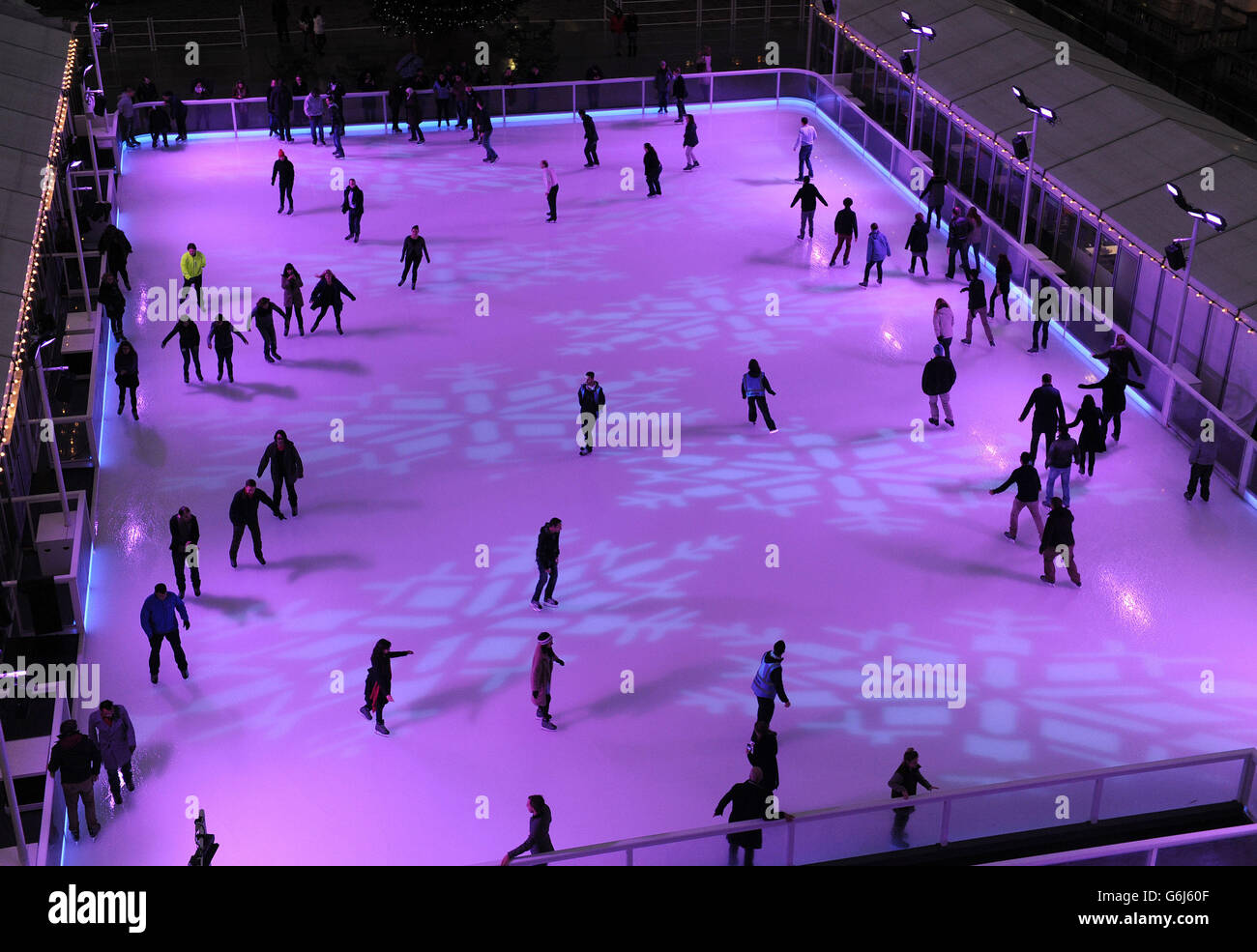 Members of the public on the ice rink at Somerset House. The rink is ...