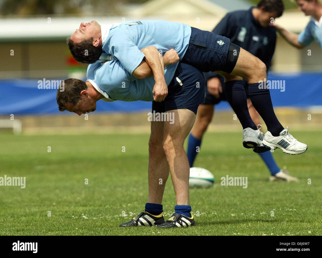 David Humphreys streches out on Guy Easterby's back during Ireland's ...