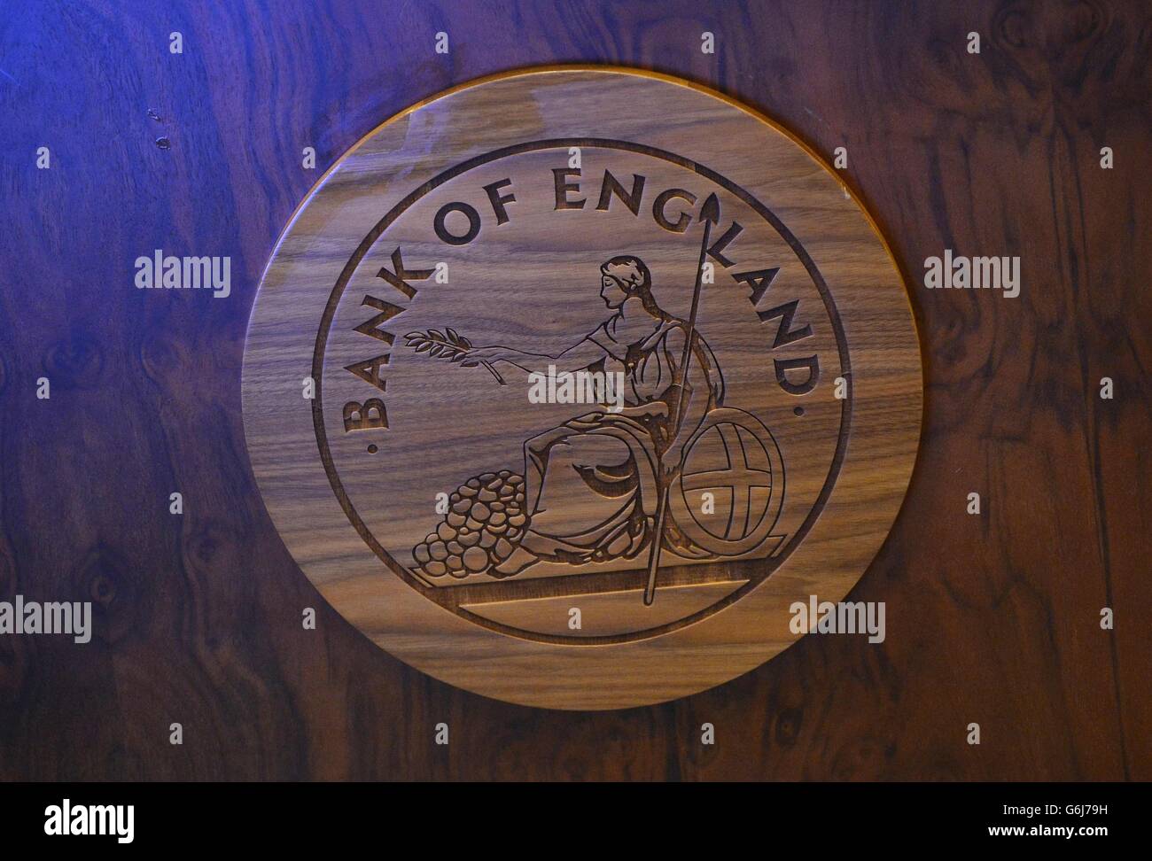 A wooden carving of the Bank of England logo on a desk during the bank ...