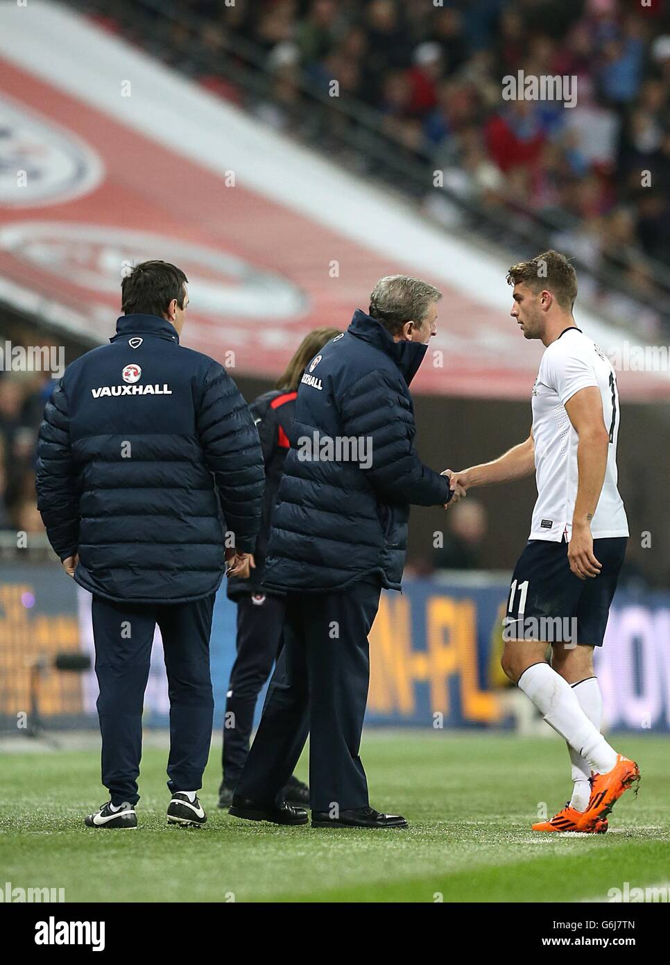 England manager Roy Hodgson (centre) shakes the hand of Jay Rodriguez ...