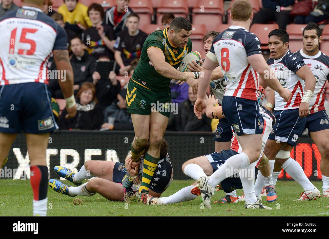 Australia's Greg Inglis battles his way past USA's Kristian Freed to ...