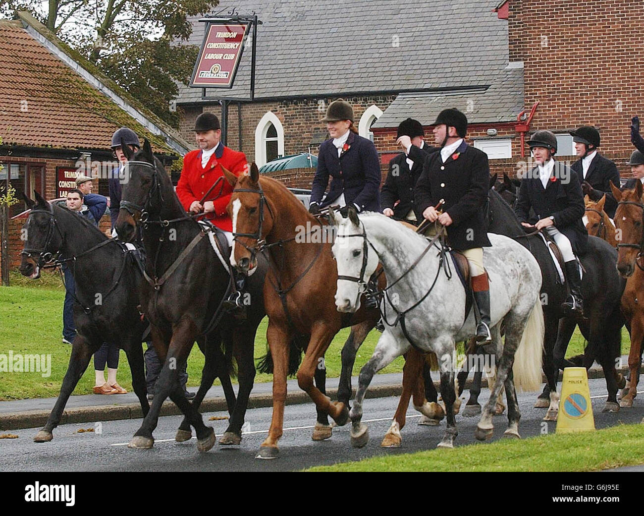 Huntsmen and hounds ride past the trimdon labour club hi-res stock ...