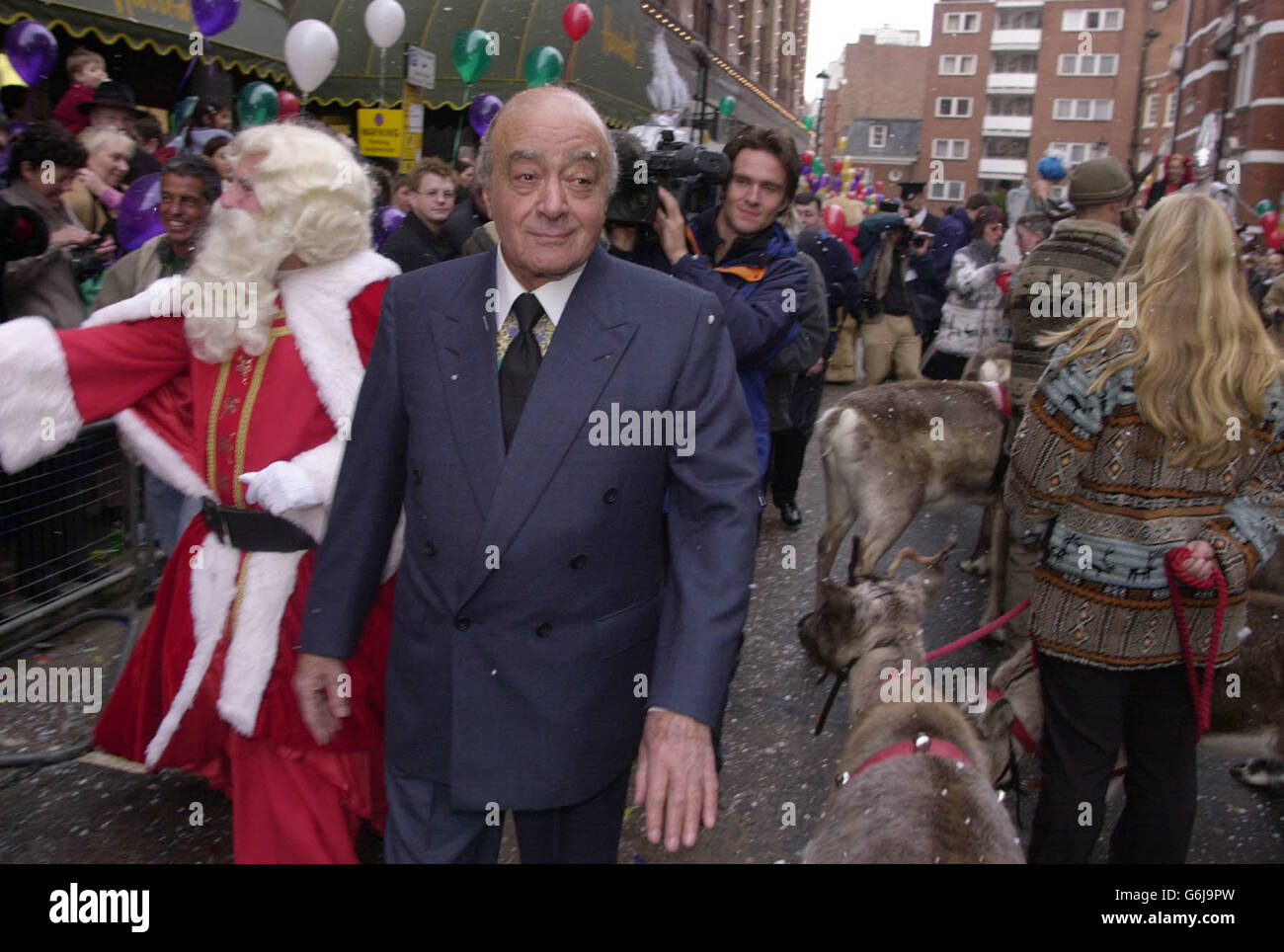 The owner of Harrods Mohammed Al Fayed takes Father Christmas on a tour ...