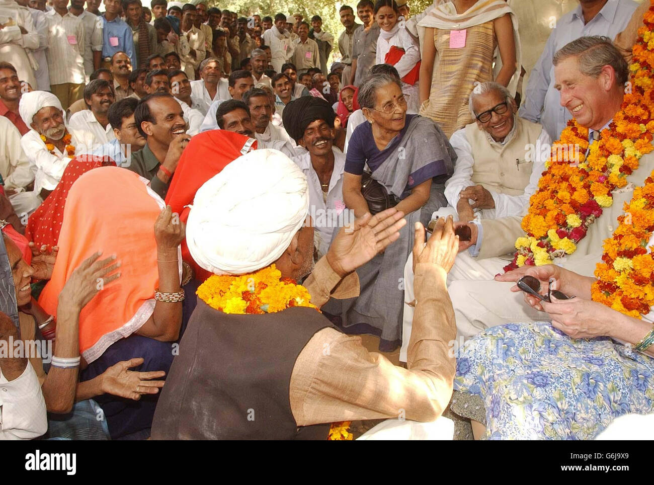 The Prince of Wales talks to villagers, in the remote Indian village of ...