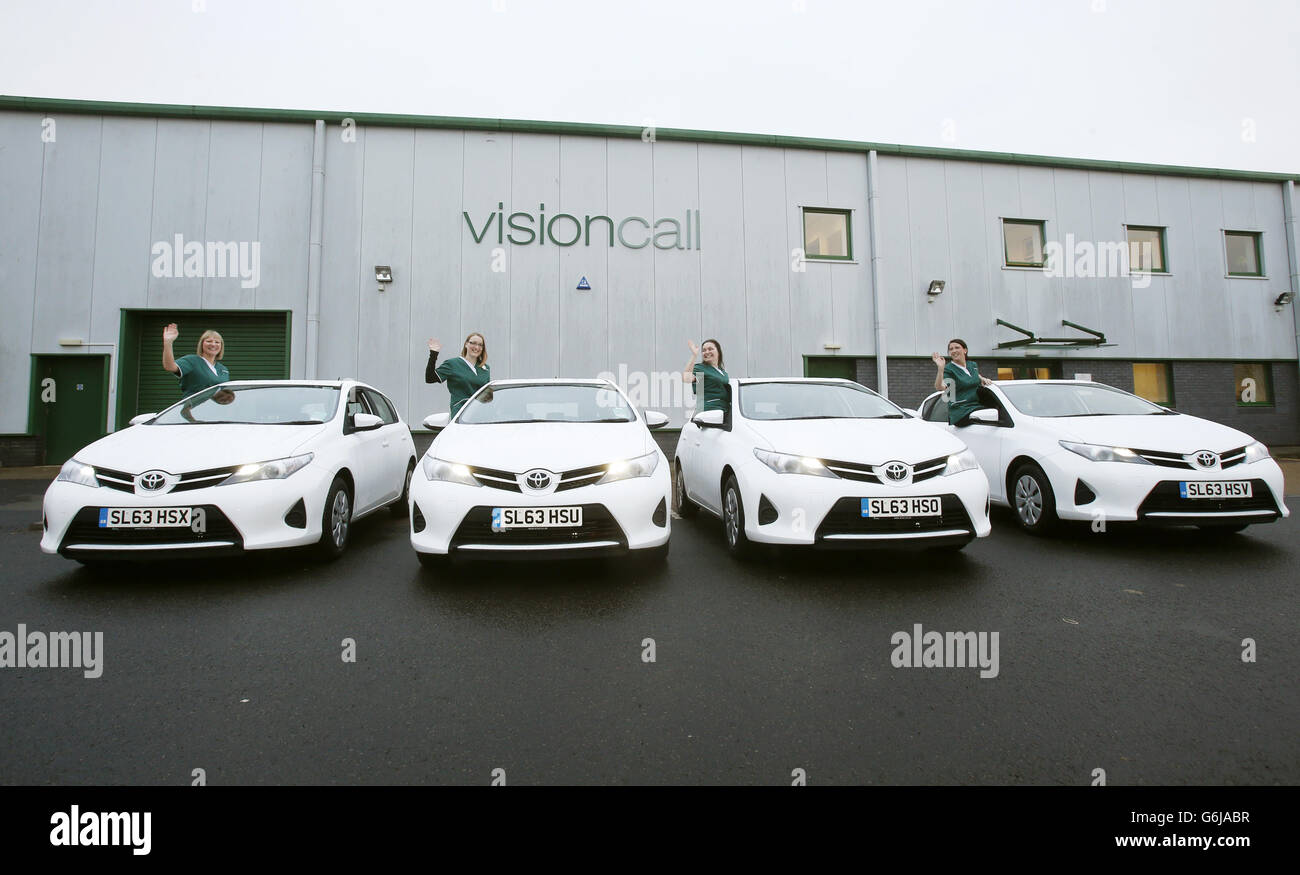 Visioncall employees are pictured with Toyota cars at the Visioncall ...