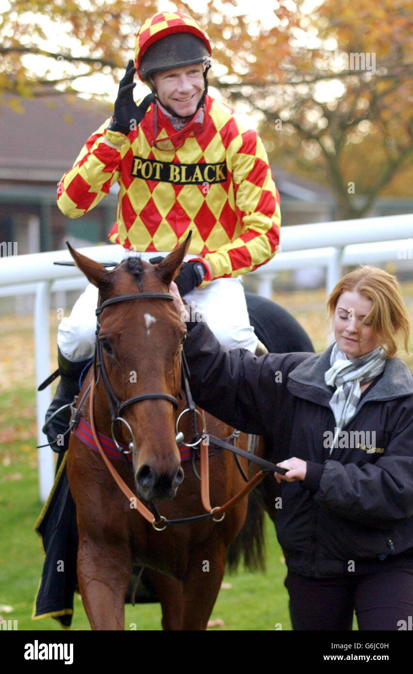 Jockey Mick Fitzgerald, 33, enters the winners enclosure on County Cork ...