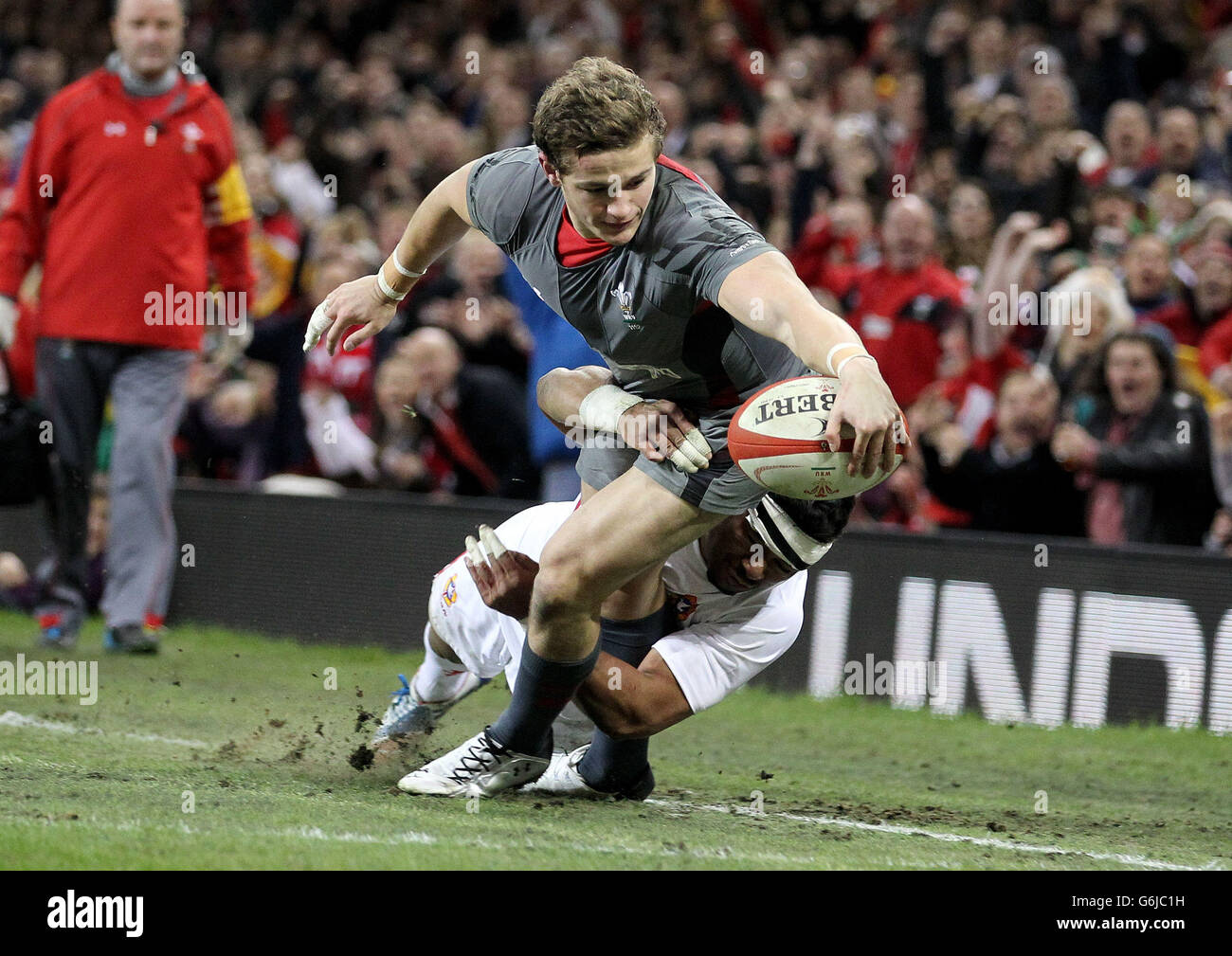 Wales Hallam Amos is tackled by Tonga's Siale Piutau during the Dove ...