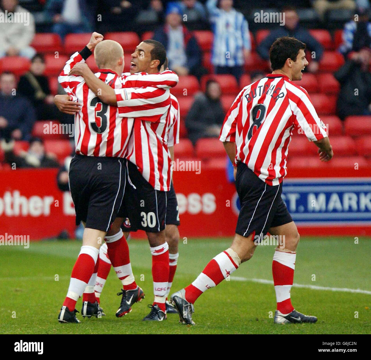 Lincoln's Paul Mayo (far left) celebrates with team-mates after scoring ...