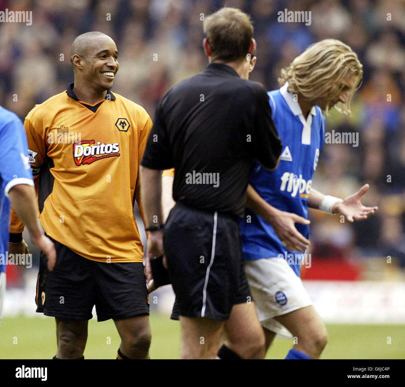 Wolverhampton Wanderers' Paul Ince (left) smiles after a clash with ...
