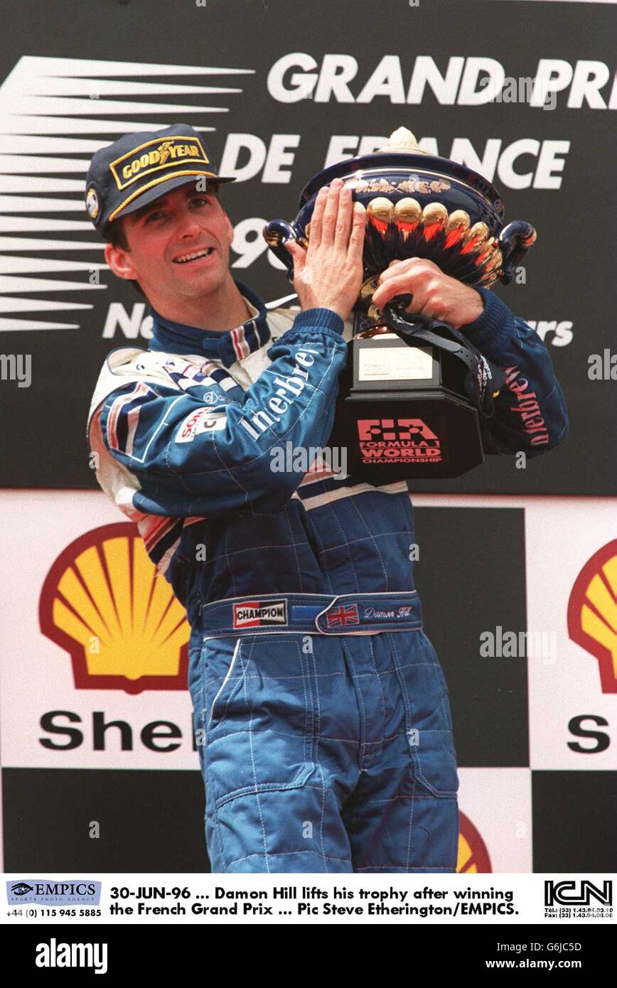 30-JUN-96, Damon Hill lifts his trophy after winning the French Grand ...