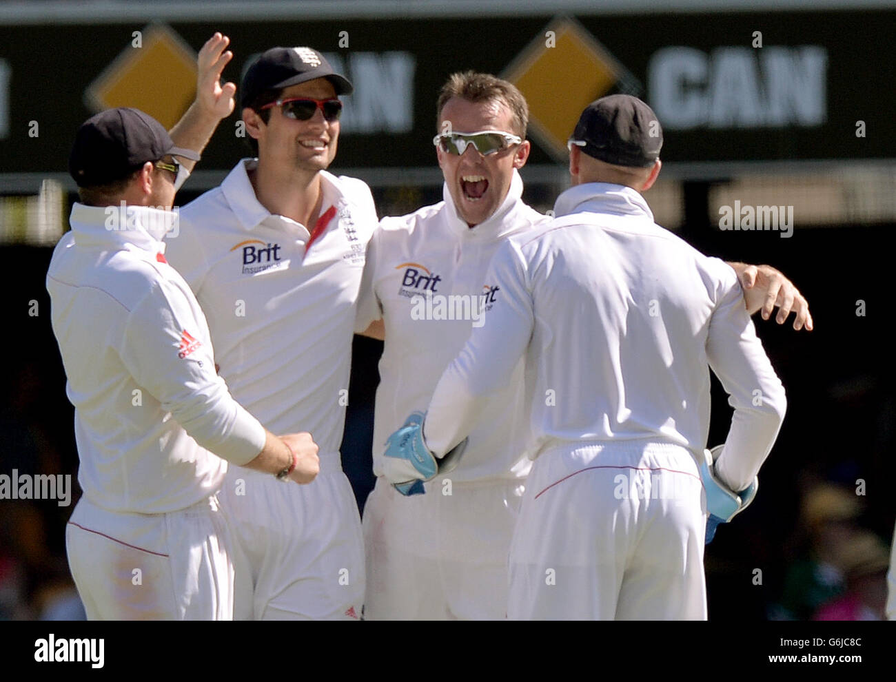 England's Graeme Swann (second right) celebrates with Alastair Cook ...