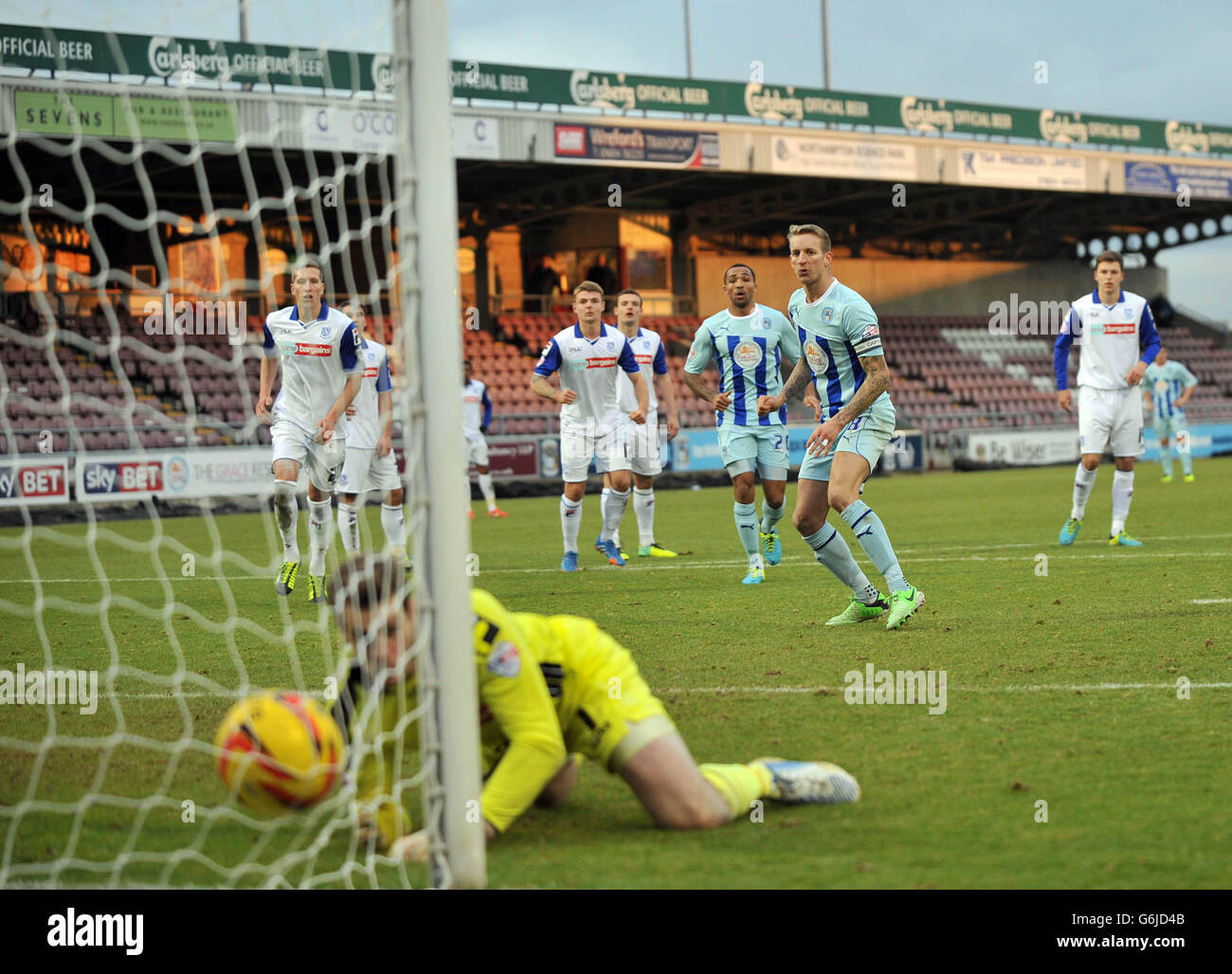 Coventry City's Captain Carl Baker (right) scores from the penalty spot ...