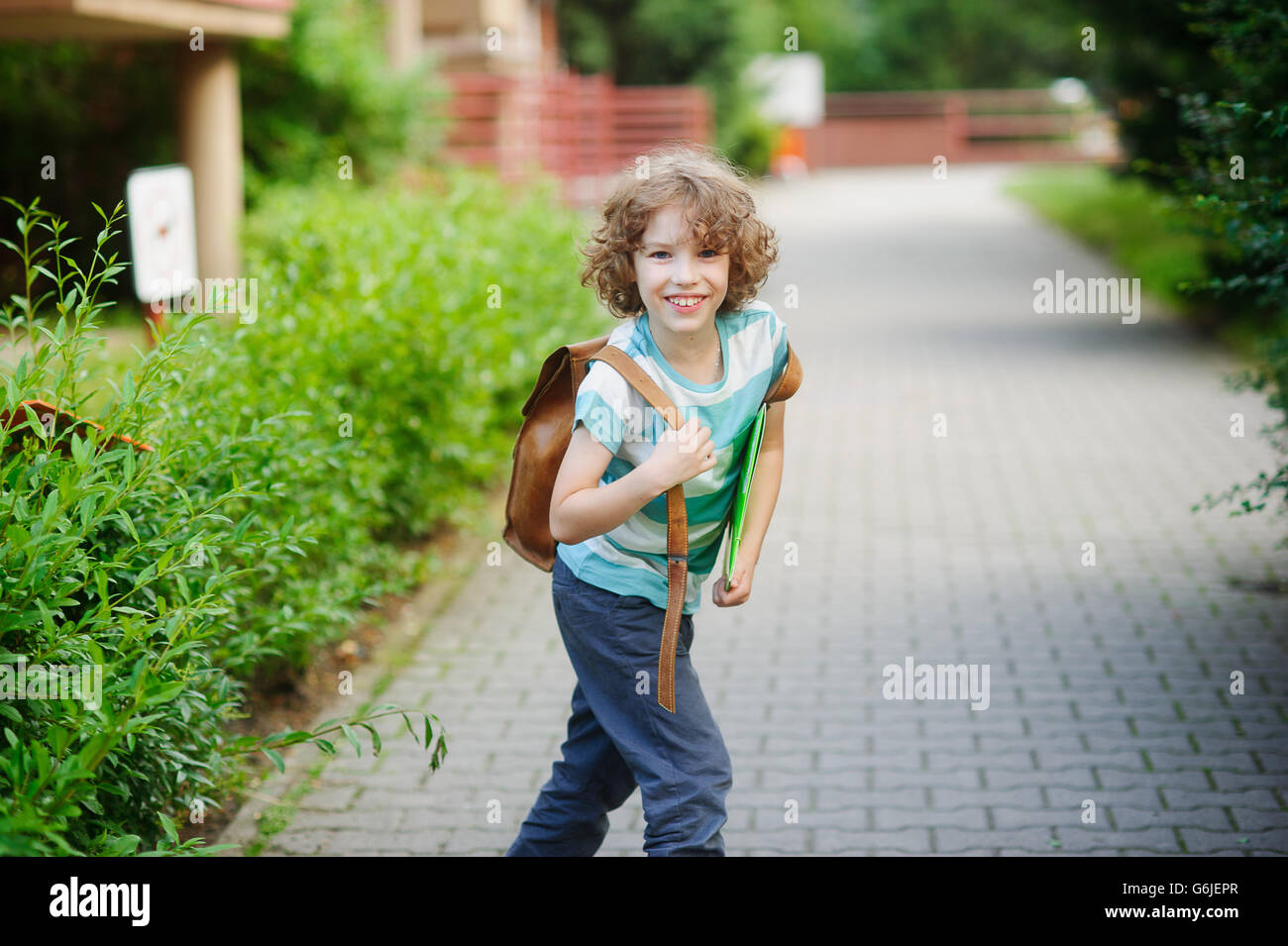 Cheerful schoolboy. The boy of 8-9 years looked back and with a ...