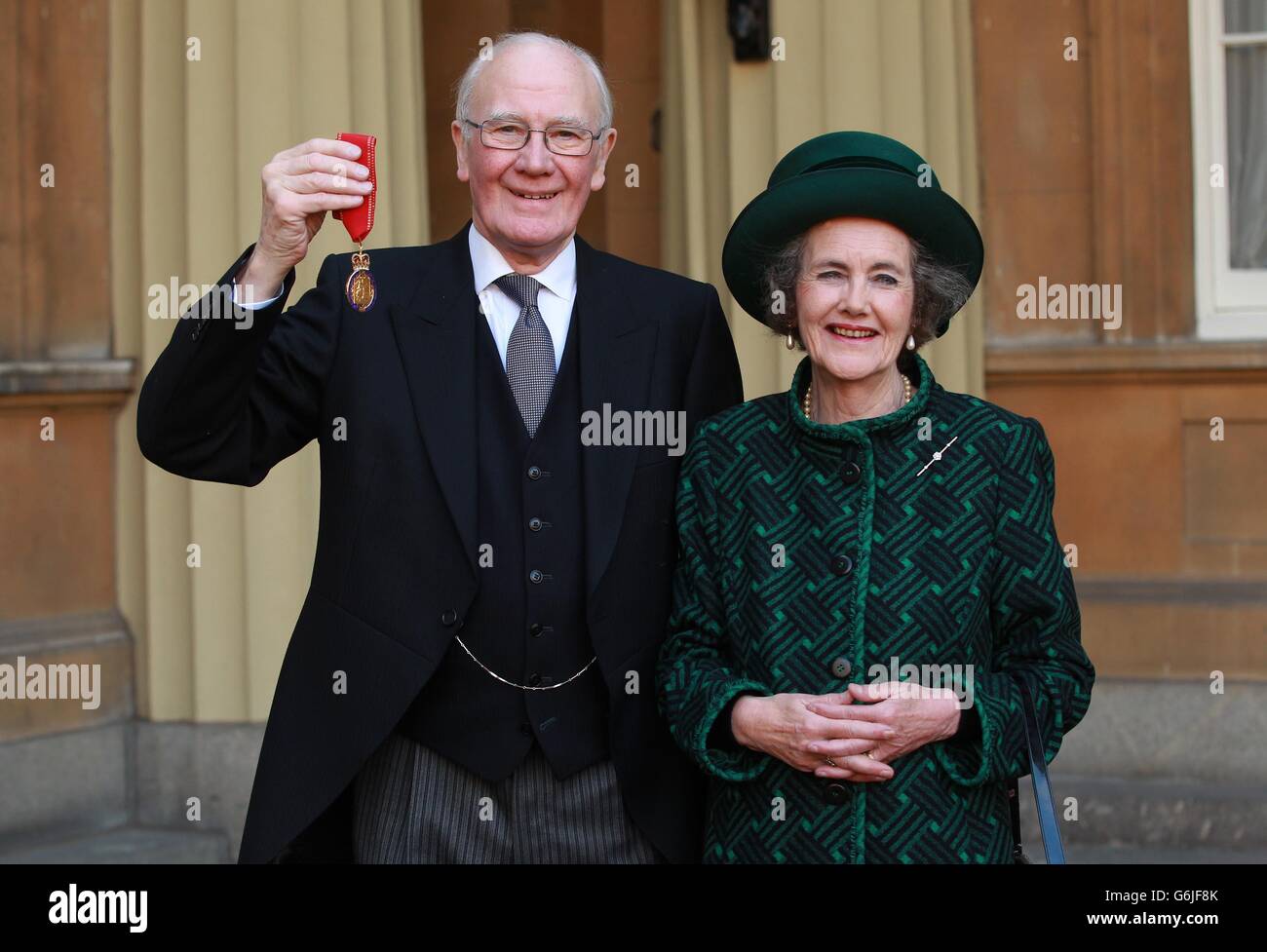 Sir Menzies Campbell holds his medal, with his wife Lady Elspeth ...