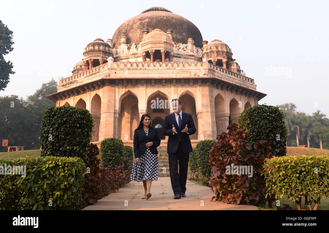 Prime Minister David Cameron speaks with Witham MP Priti Patel in front ...