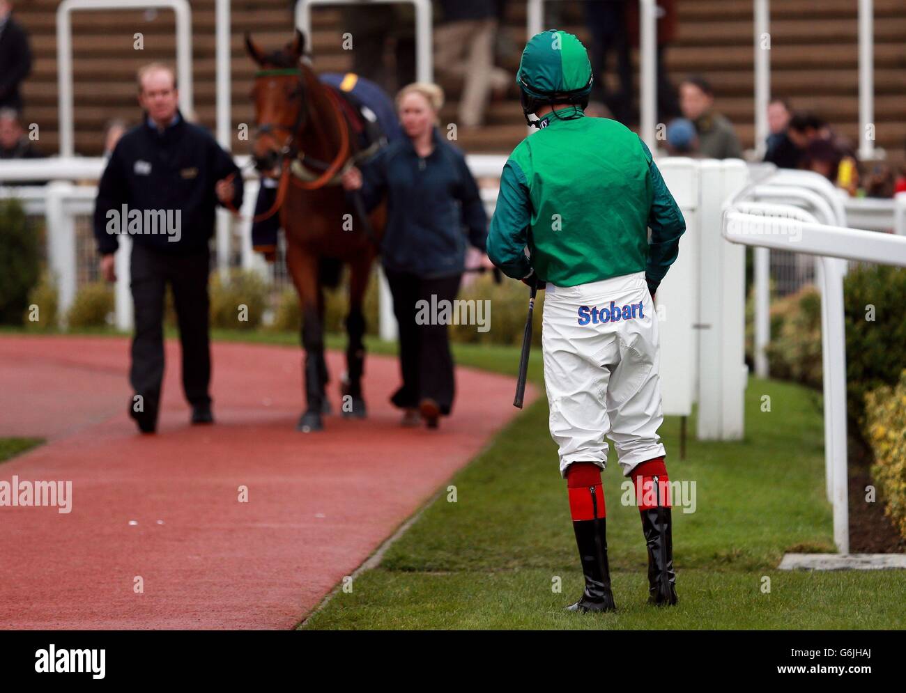 Jockey Robert Thornton waits for his ride in the parade ring for the ...