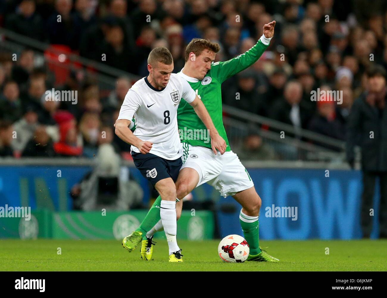England's Tom Cleverley (left) and Germany's Max Kruse battle for the ...